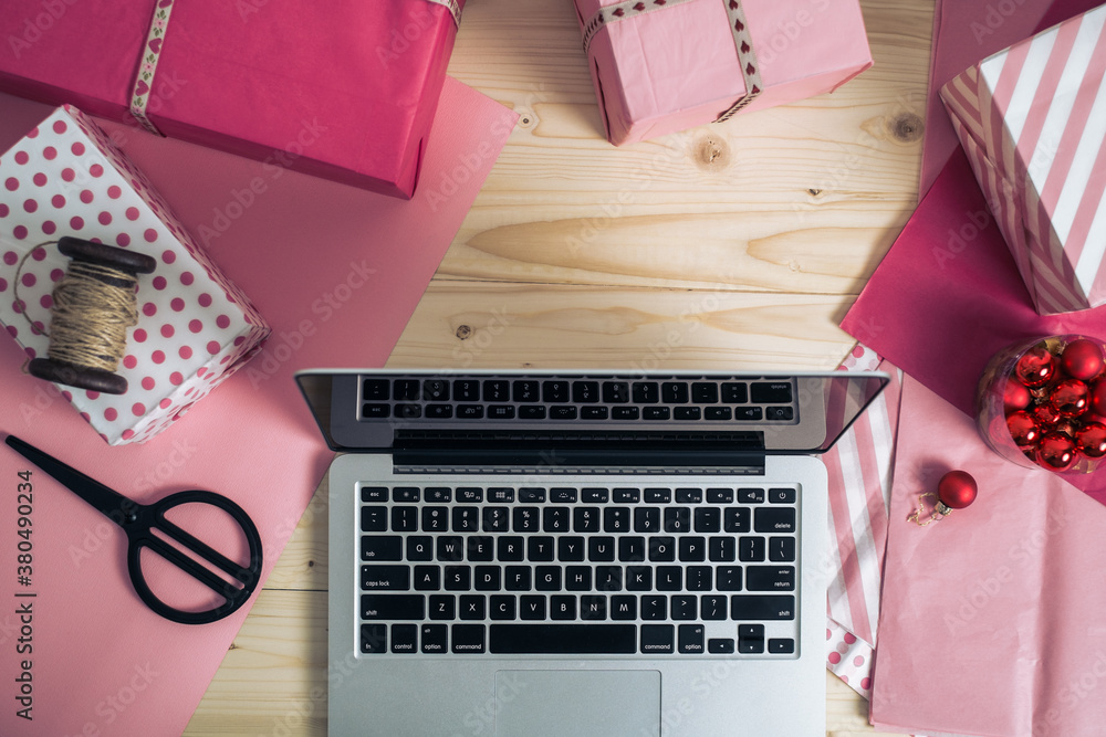 Laptop, Wrapping Paper and Presents on the Desk Stock Photo | Adobe Stock