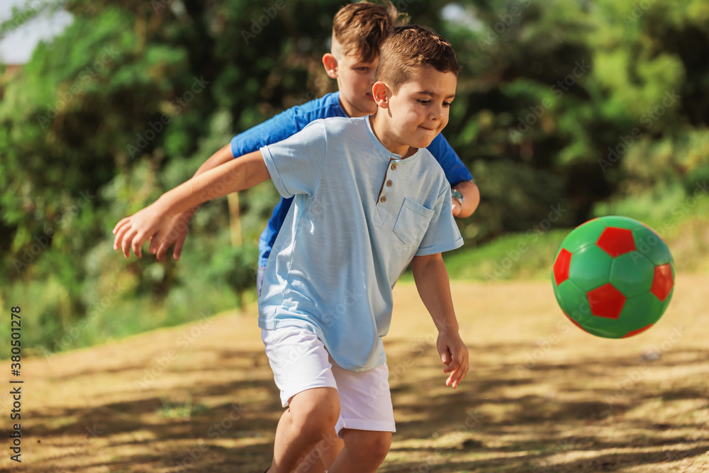 two kids playing ball and having fun Stock Photo | Adobe Stock