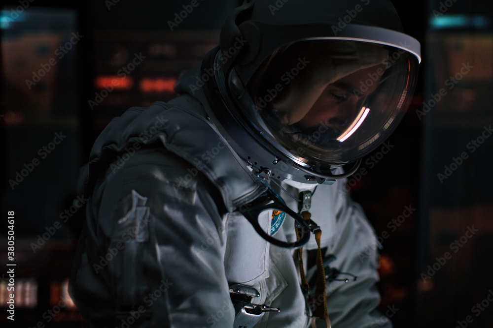 An Astronaut working inside his space shuttle Stock Photo | Adobe Stock