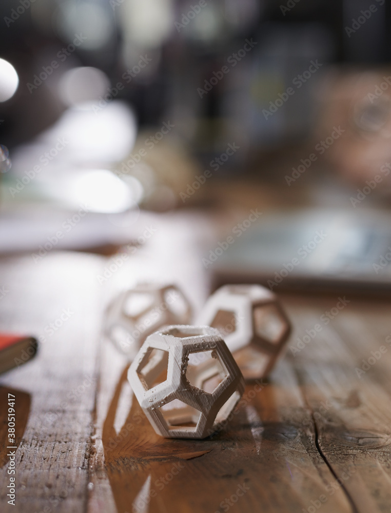 3d printed hexagon design sample on engineer wooden desk with soft ...