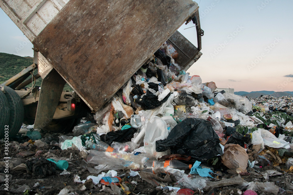 Garbage truck at landfill Stock Photo | Adobe Stock