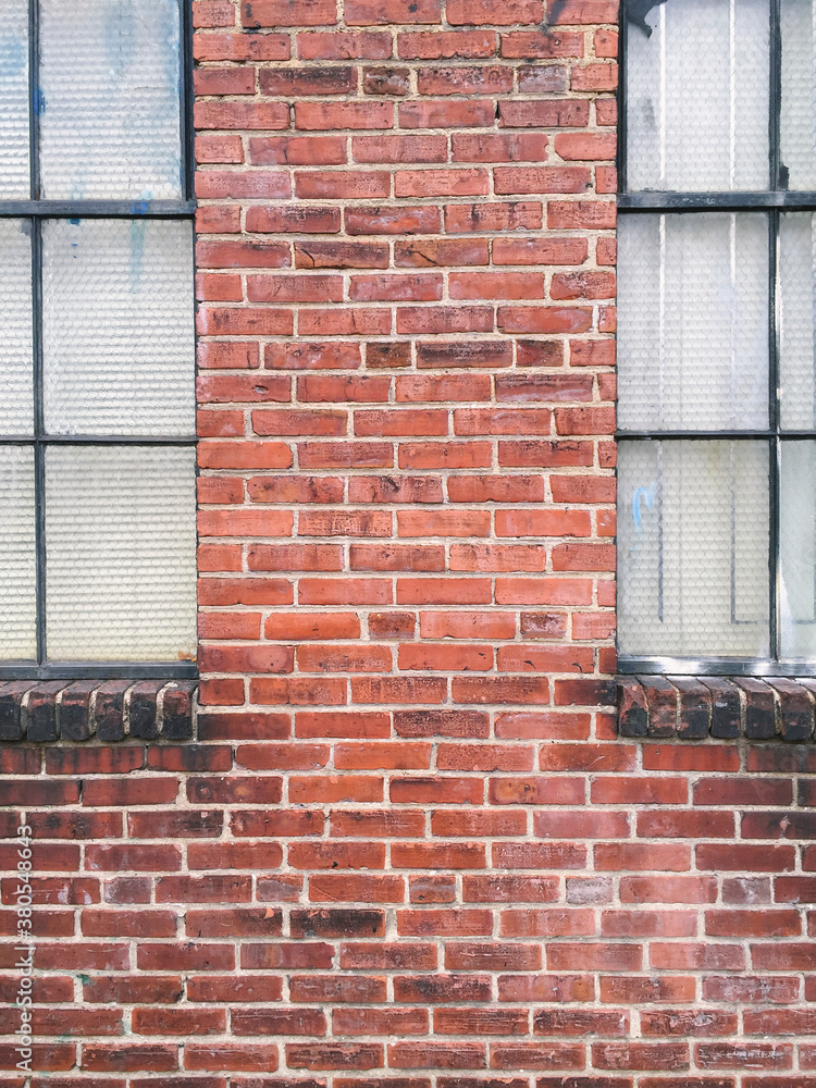 Facade of a brick building with white curtains in the windows Stock ...