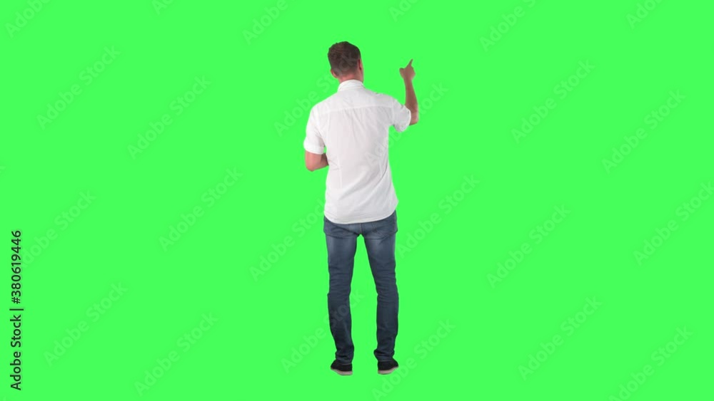 Back view of business man interacting with invisible touch screen ...