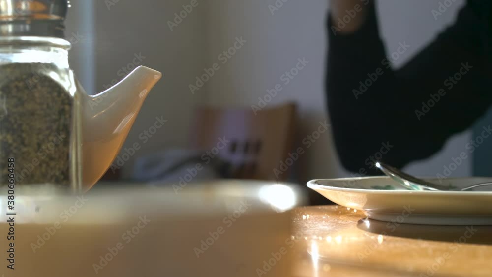 Close-up of a bejeweled hand pouring tea and raising a china cup Stock ...