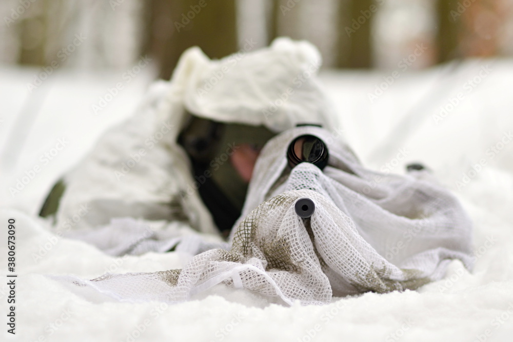 Camouflaged sniper with rifle in winter forest Stock Photo | Adobe Stock