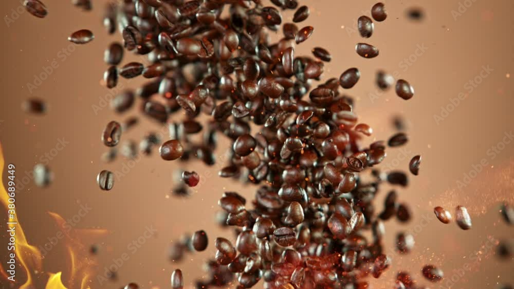 Coffee beans collision with fire flames, super slow motion filmed on ...