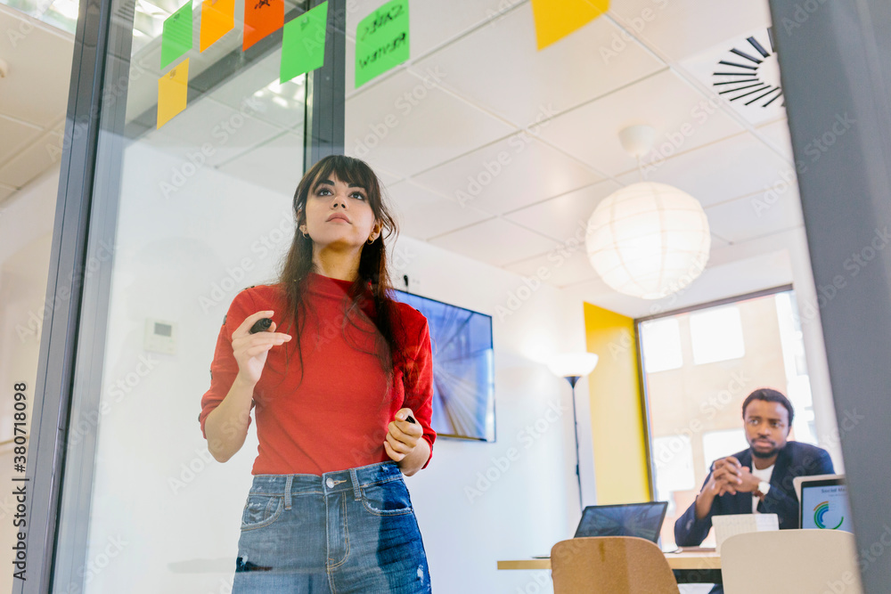 Smart woman creating strategy drawing items on sticky notes Stock Photo ...