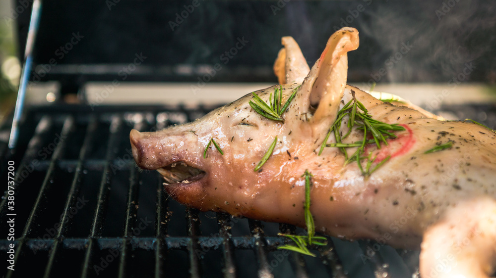 BBQ whole grilled pig in garden house. Home cooking of crispy roasted ...