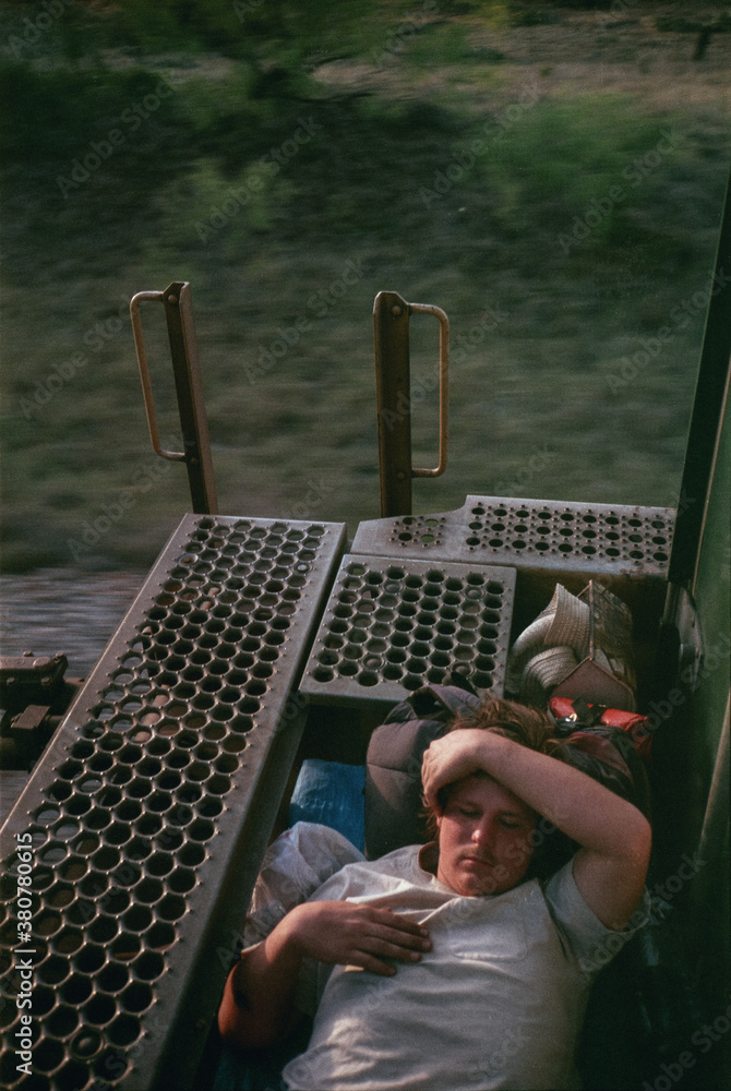 Young Man Sleeping on Freight Train Stock Photo | Adobe Stock