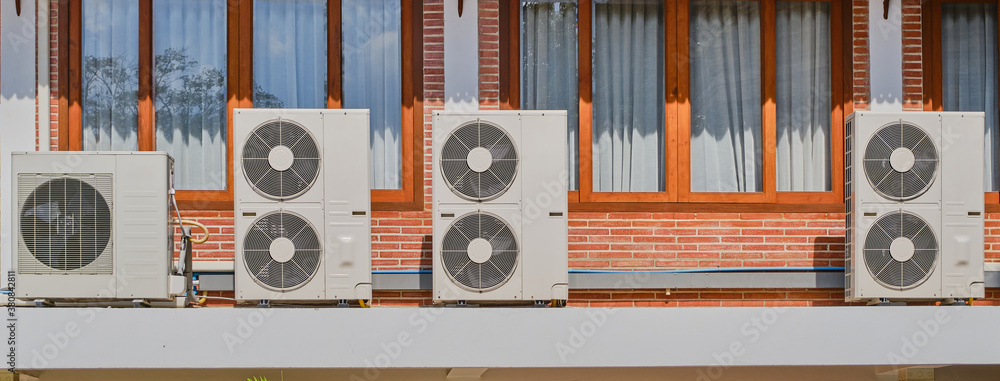 Air Compressors Installed on the side of building. Stock Photo | Adobe ...
