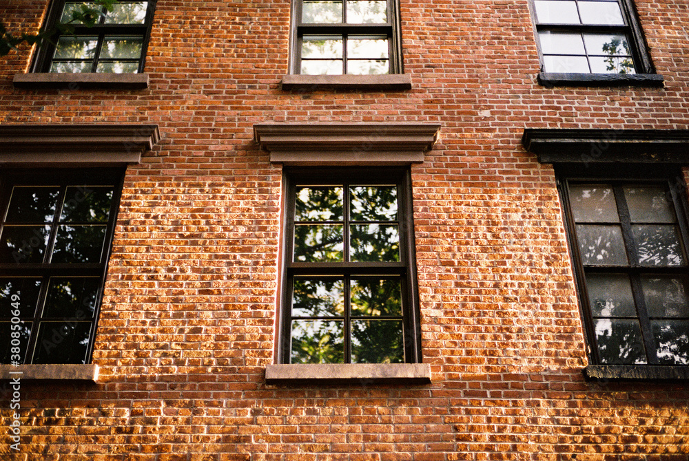 Sunlight accentuates the side of a brick building Stock Photo | Adobe Stock