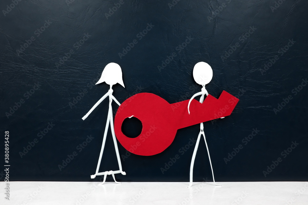 Stick man couple figure carrying a big red key in dark background with ...