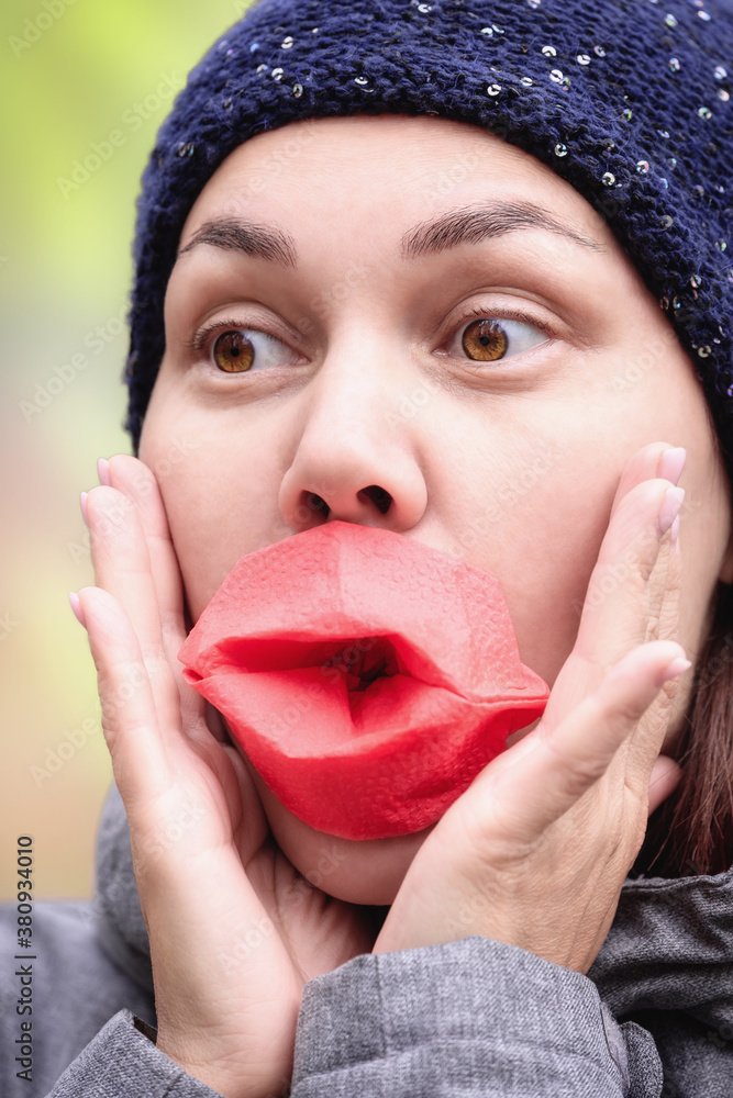 Surprised girl with big red lips from napkin. Lip concept. Stock Photo ...