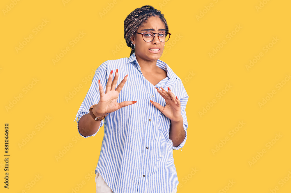 Young african american woman with braids wearing casual clothes and ...