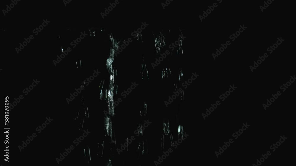 Jets of rain flow down the canopy in slow motion. Water streams close ...