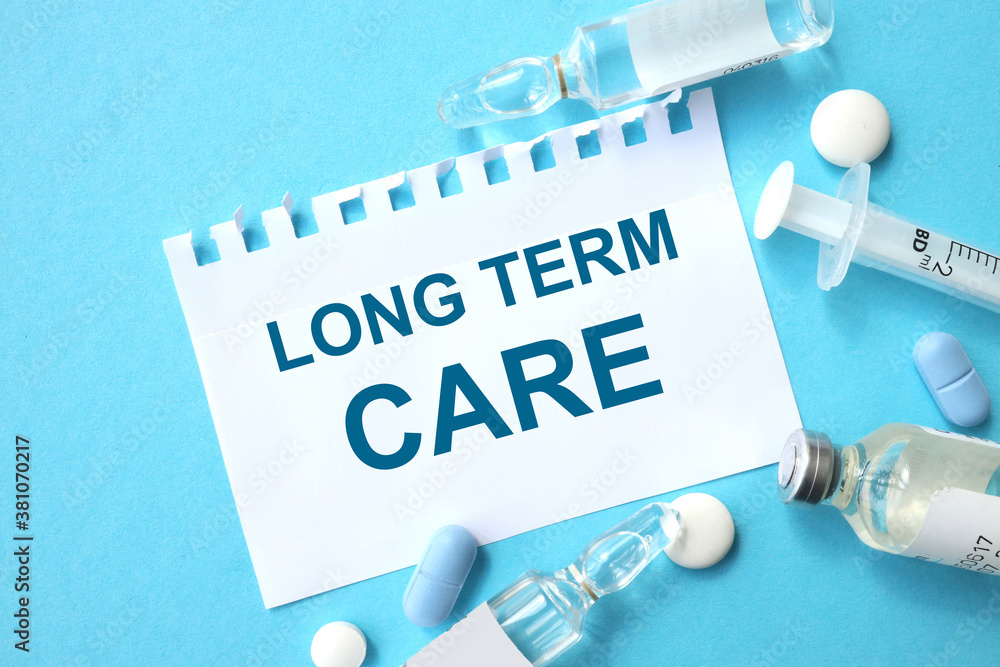 Long-Term Care. text on a blue background near the syringe and ampoules ...