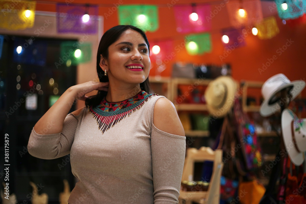 beautiful smiling mexican woman in traditional mexican dress hands up ...