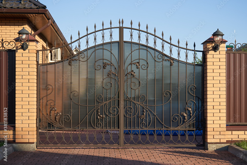 Forged metal gates with ornate lines to enter a private house Stock ...