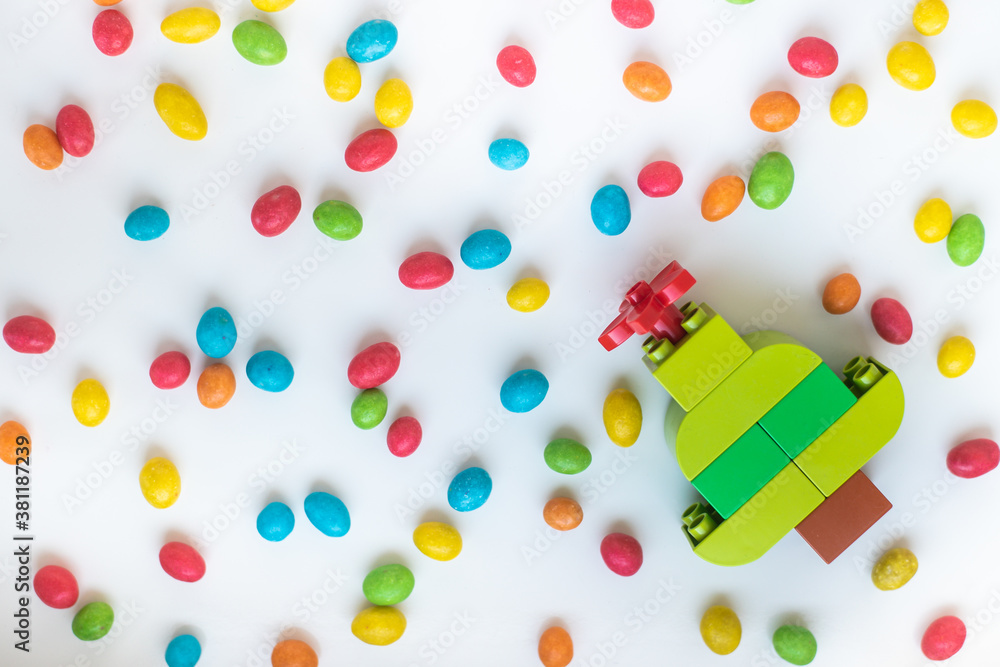 fur-tree from the constructor and multicolored spots on a white ...