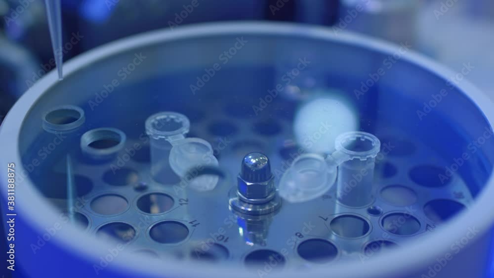 Apparatus for automatic sampling, analysis. A robo hand takes a sample ...