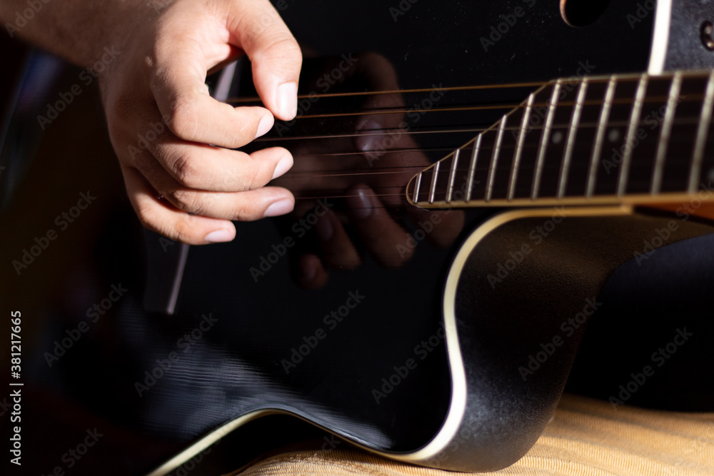 musician playing the guitar Stock Photo | Adobe Stock