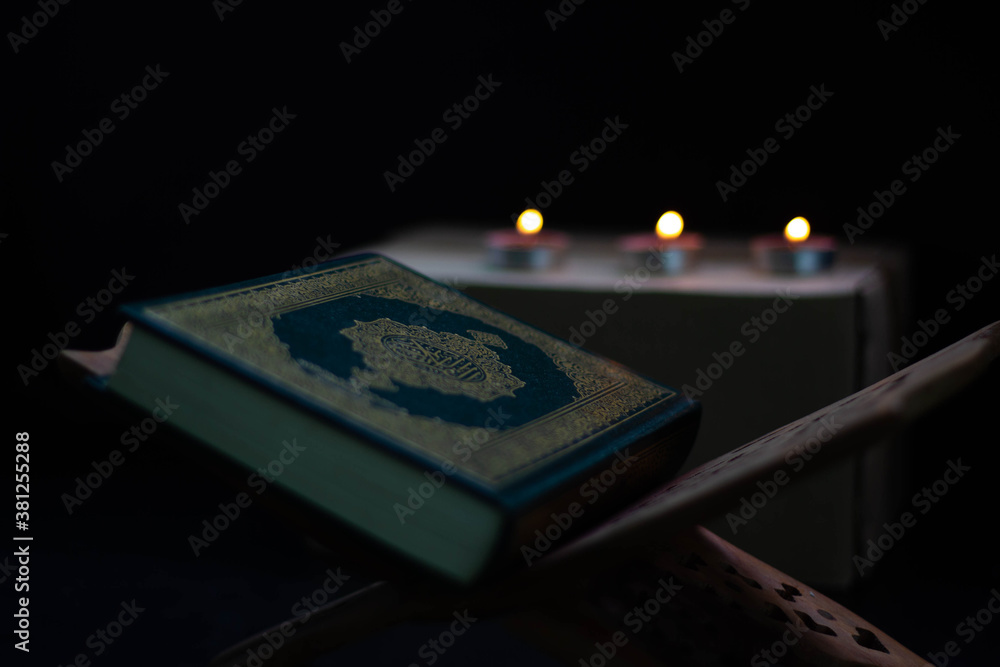 Quran in the mosque - open for prayers The black background of the ...
