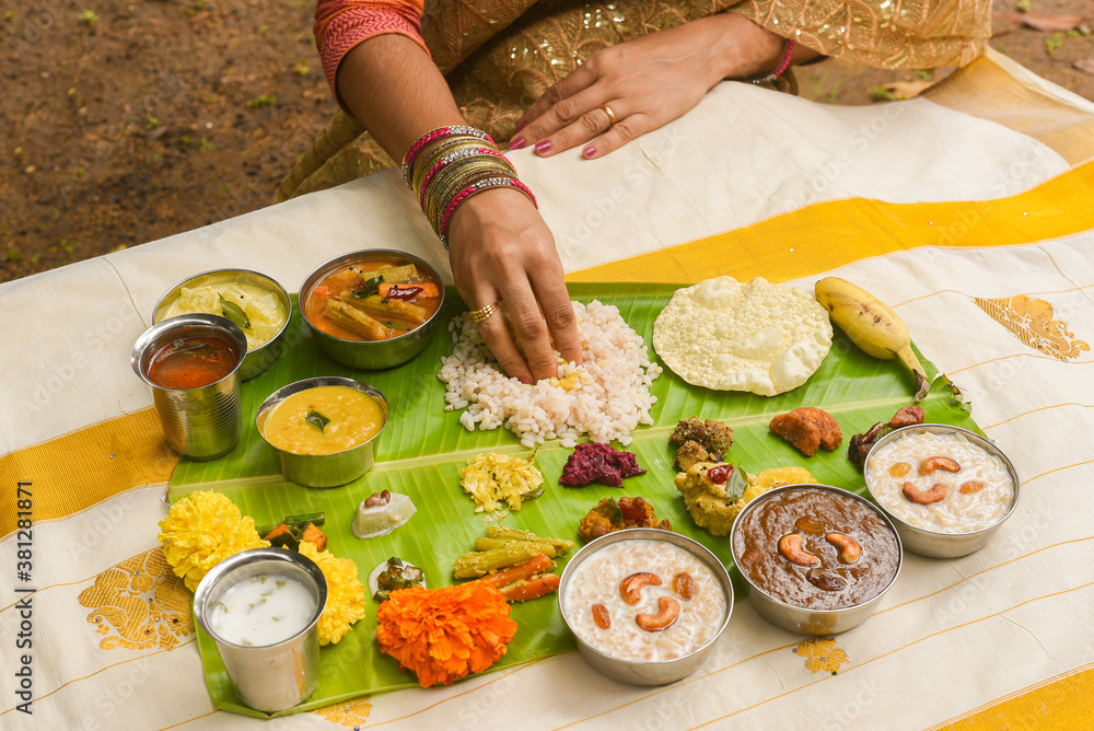 Onam sadhya, Indian women eating with hand boiled rice, served for ...