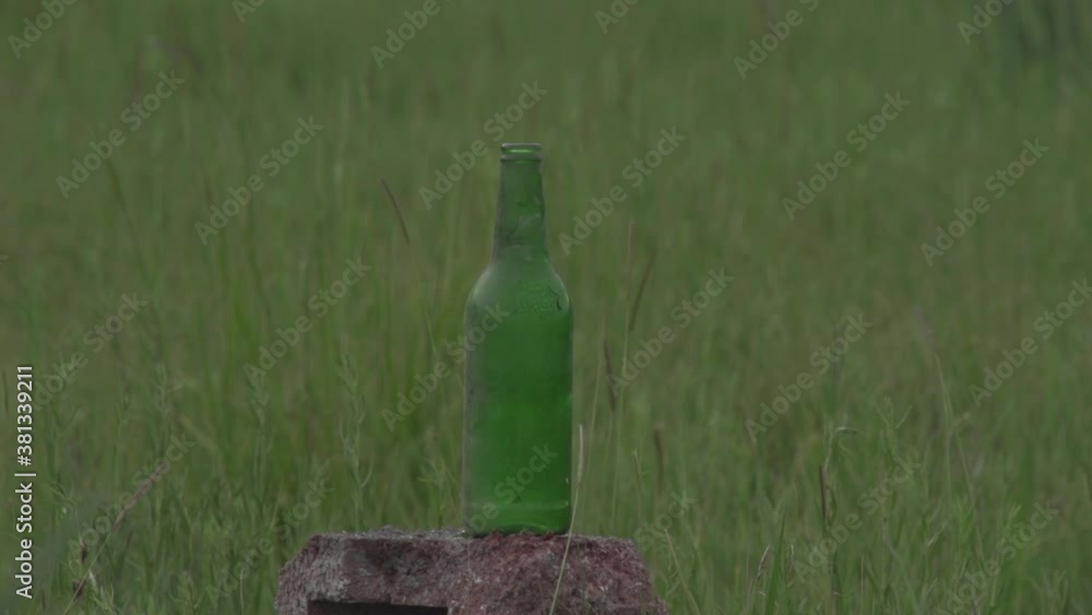 Bottle Explodes with Shards. Bottle shatters from getting a hunting ...