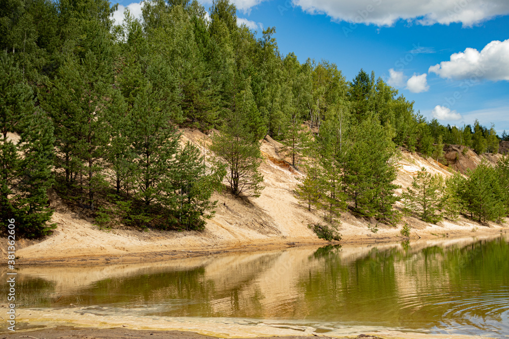 Large quarry for the extraction of clay, inactive, reclaimed. Trees ...