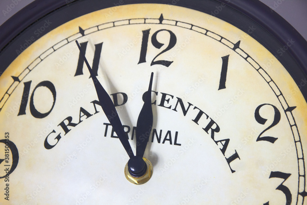 Detail of a clock face with hands showing the hour five to twelve Stock ...