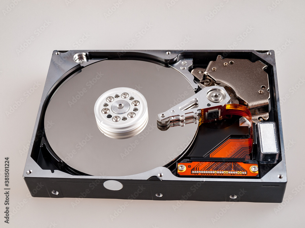 mechanical movable hard disk, with magnetic head in disassembled state ...