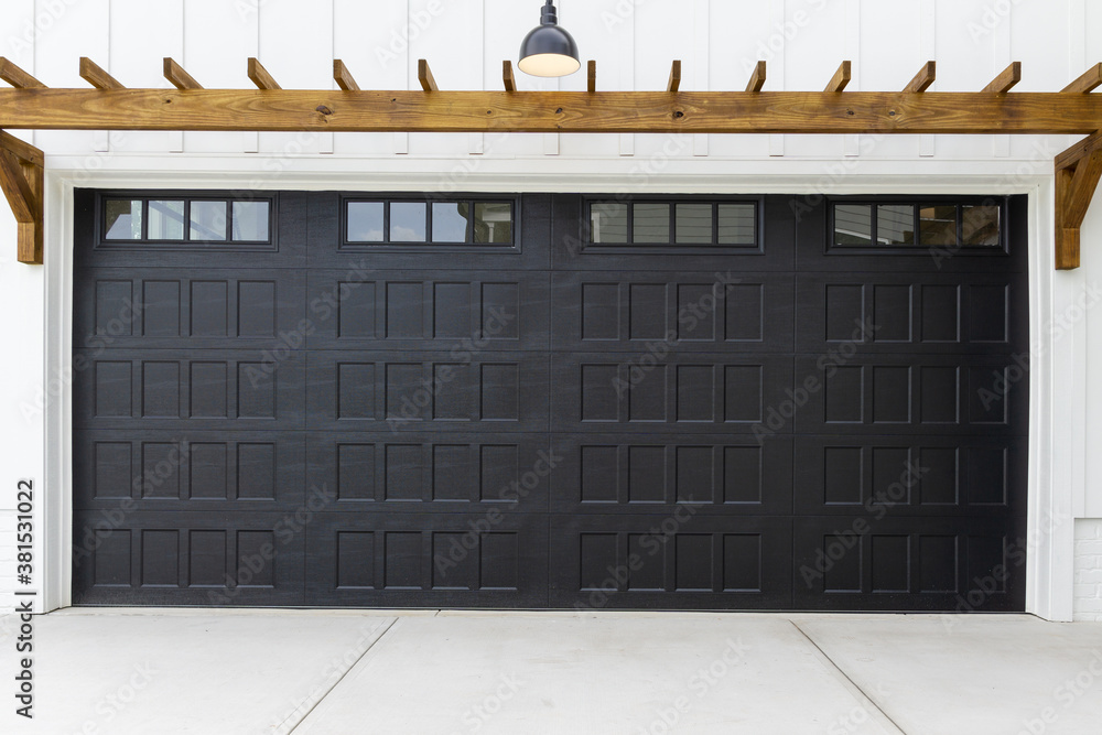 Residential house two car garage doors Stock Photo | Adobe Stock
