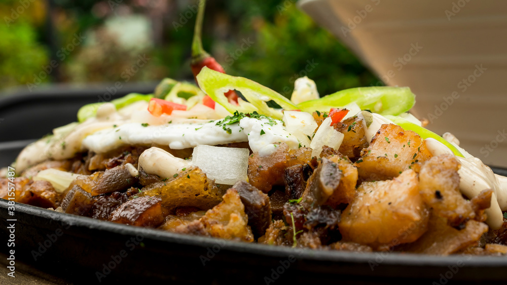 Side view closeup of Pork Sisig, A popular Filipino Dish. Stock Photo ...