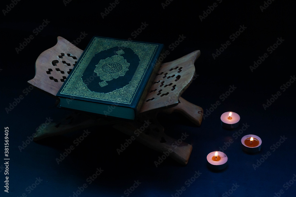 Quran in the mosque - open for prayers The black background of the ...