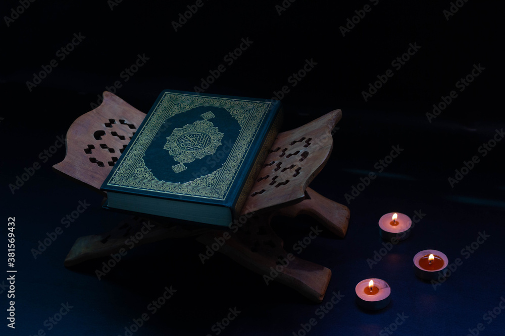 Quran in the mosque - open for prayers The black background of the ...