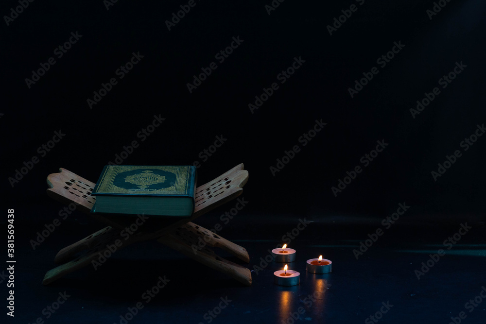 Quran in the mosque - open for prayers The black background of the ...
