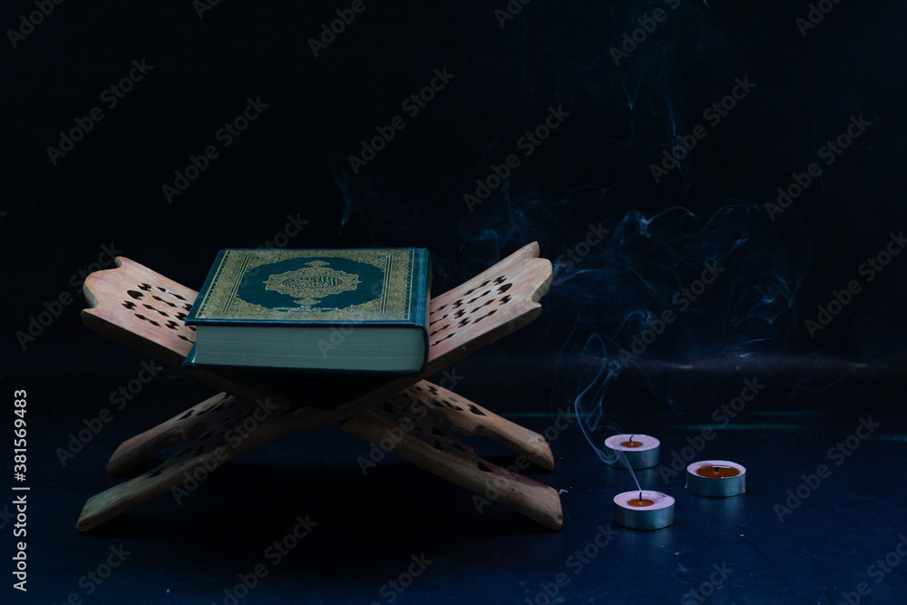 Quran in the mosque - open for prayers The black background of the ...