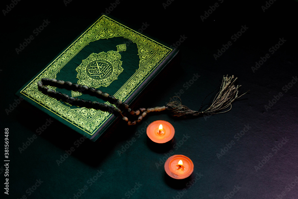 Quran in the mosque - open for prayers The black background of the ...