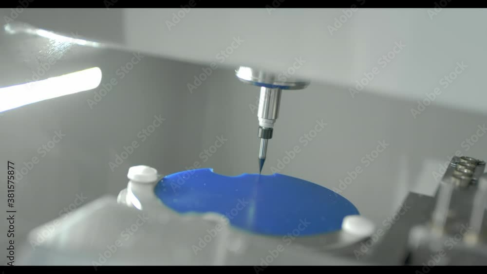 Stockvideo rofessional CNC dental milling machine carving out shape of ...