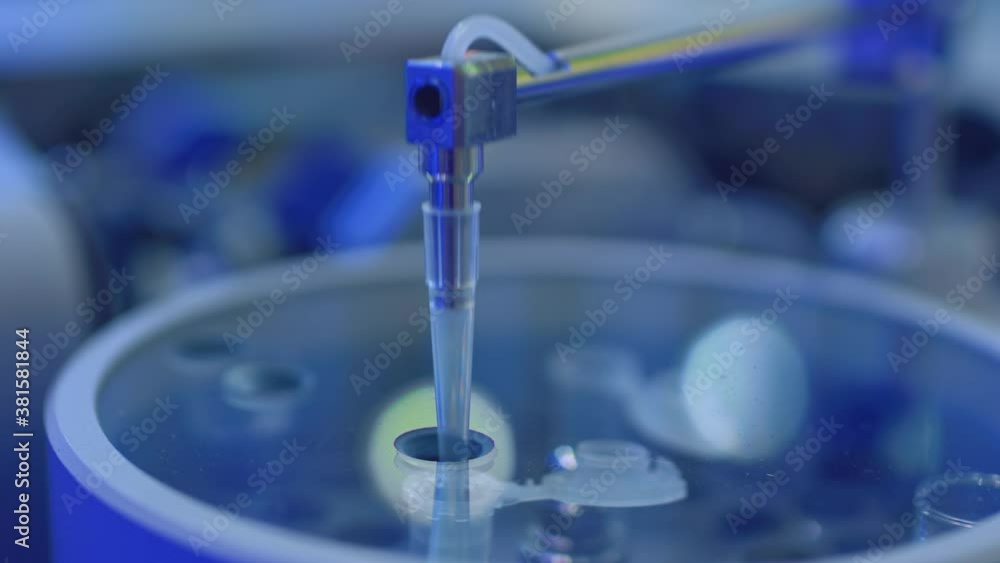 Apparatus for automatic sampling, analysis. A robo hand takes a sample ...