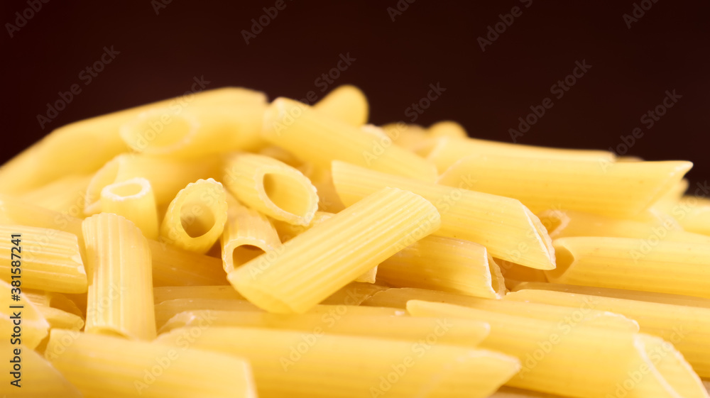 Penne Rigate Raw Pasta is a short pasta with oblique cuts and a ribbed ...