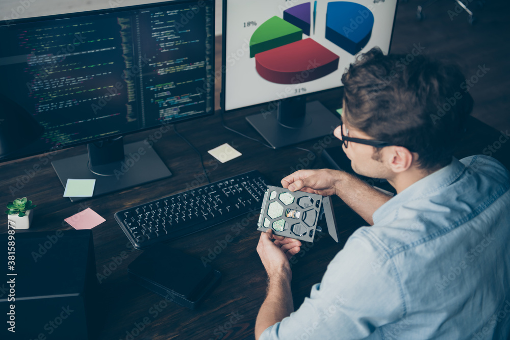 High angle view back rear spine photo of focused it specialist guy ...