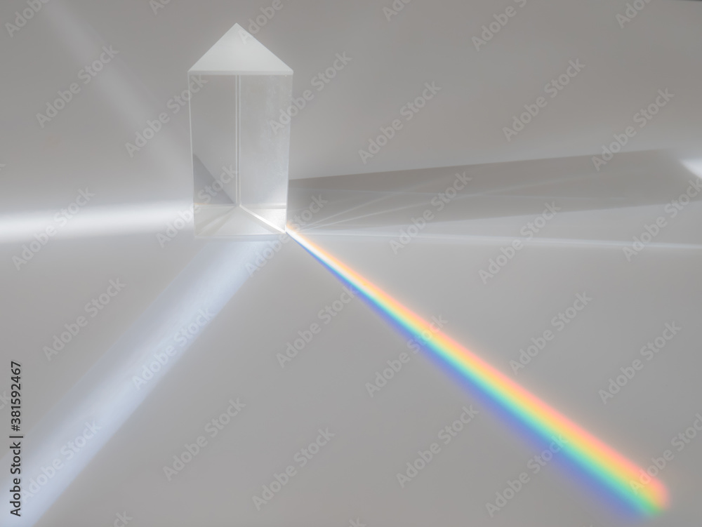 Scattering of a ray of sunlight (white light) through a prism creating ...