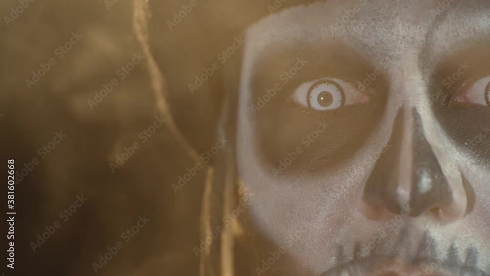 Scary man face in Halloween skeleton makeup looks in different ...