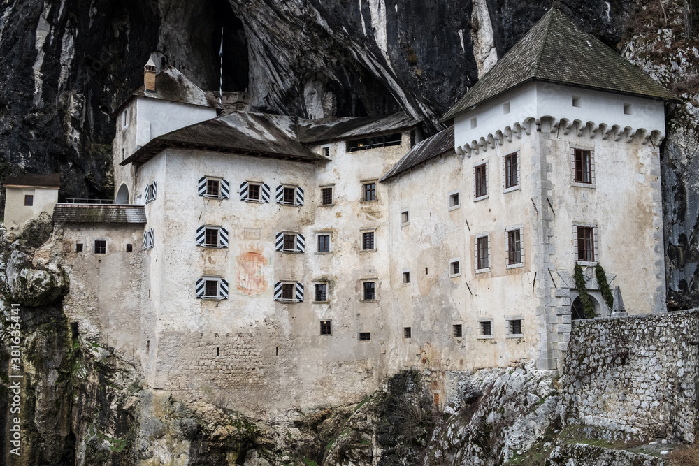 Predjama Castle, situated in the middle of a cliff near Postojna Cave ...