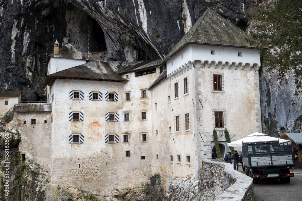 Predjama Castle, situated in the middle of a cliff near Postojna Cave ...