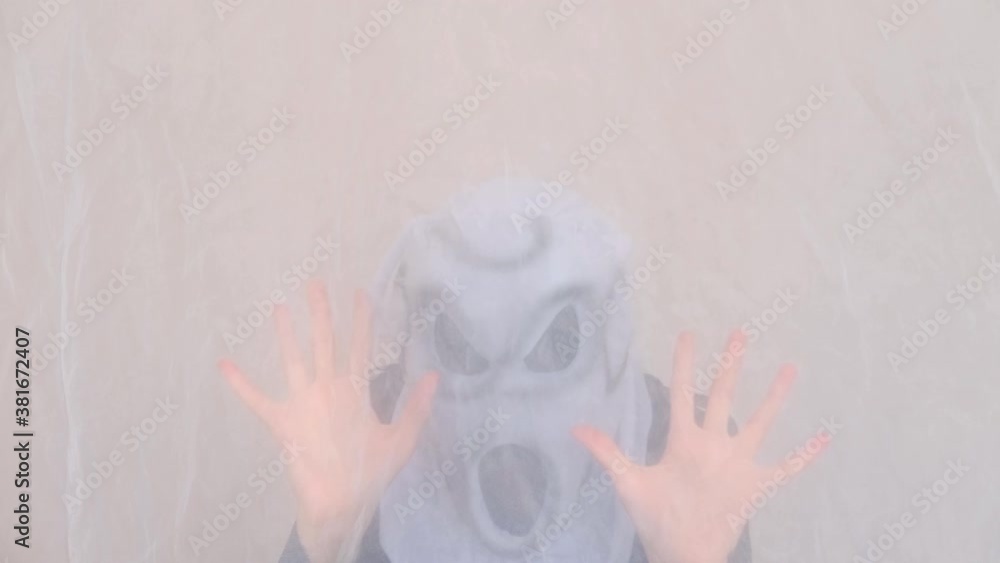 Halloween party. Unknown man in a costume and a skeleton mask ...