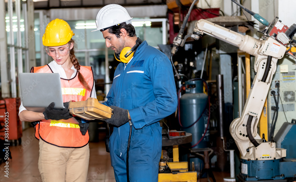 Attractive woman engineer and technician man Caucasian Are working ...