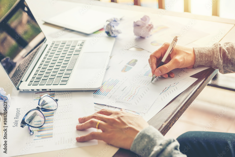 Close up businessman hand writing working with modern laptop computer ...