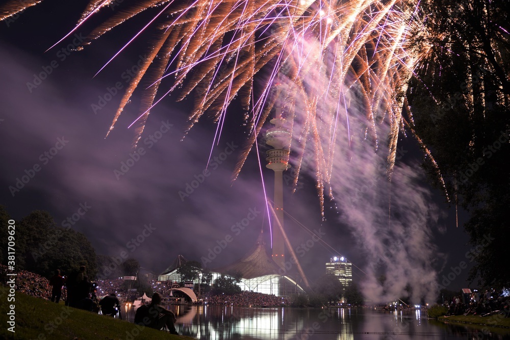 Fireworks in the olympic park in munich. Spectators watching fireworks ...